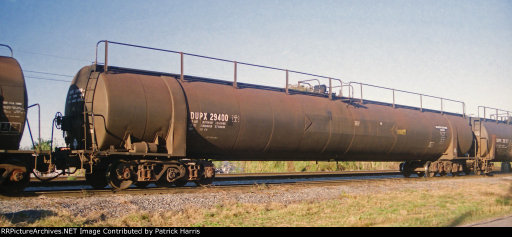 DUPX 29400 six-axle tank car eastbound from CSX Gentilly Yard in New Orleans LA 11-09-1995